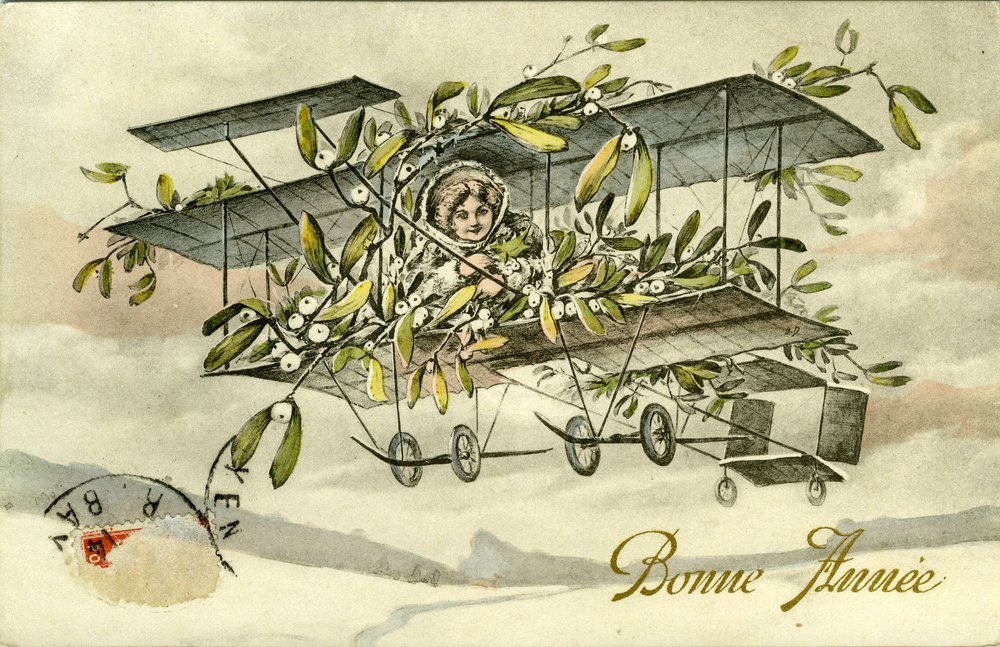 フランスファルマンの複葉機に乗った女性を描いたファンシーな写真